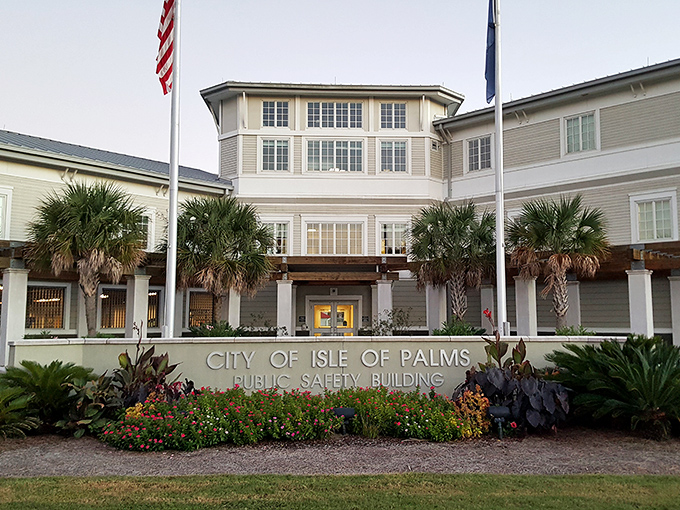 Even municipal buildings look vacation-ready in Isle of Palms, where palm trees and petunias frame civic responsibility.