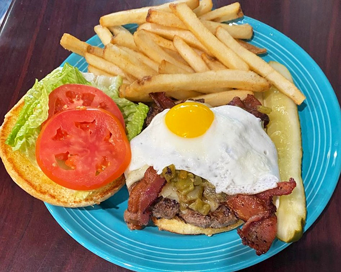 This burger proves breakfast and lunch should stop fighting and just get married already. The sunny-side-up egg is wearing its yolk like a superhero cape.