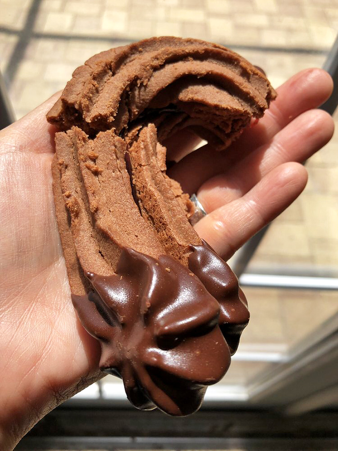 This chocolate-dipped cookie isn't just dessert&mdash;it's architecture, engineering, and pure indulgence in one handheld package. Resistance is futile.