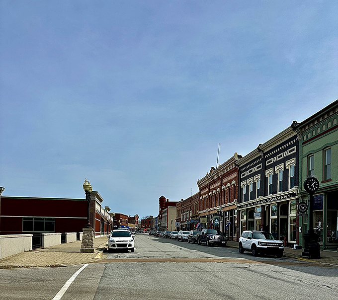 Another angle of River Street reveals the architectural time capsule that makes downtown Manistee feel like a movie set for a period drama.