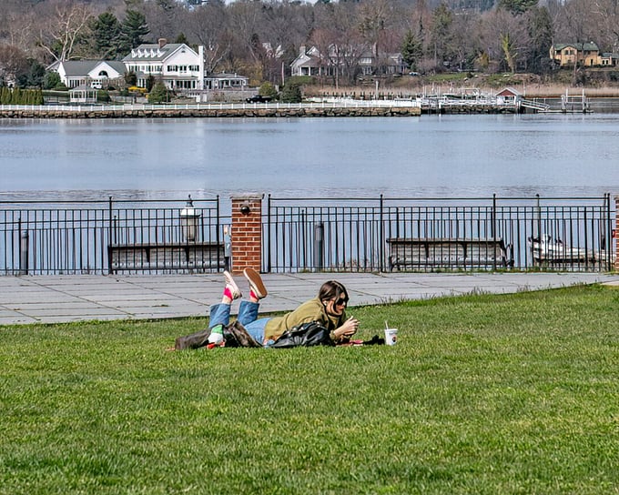 Riverside Gardens Park's winding paths and vibrant spring blooms offer a tranquil escape with the Navesink River providing nature's perfect backdrop.