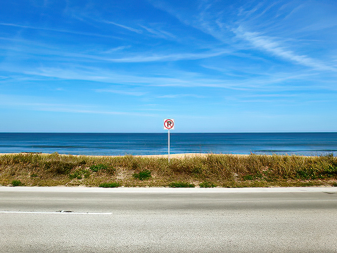 That perfect stretch where the Atlantic plays peekaboo through the dunes, flirting with passing drivers.