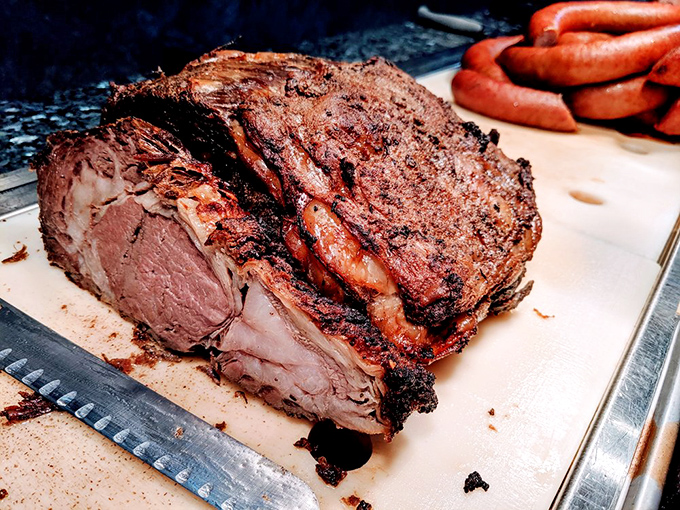 The roast beef carving station &ndash; where carnivores congregate with gleaming eyes and empty plates, ready for protein perfection.