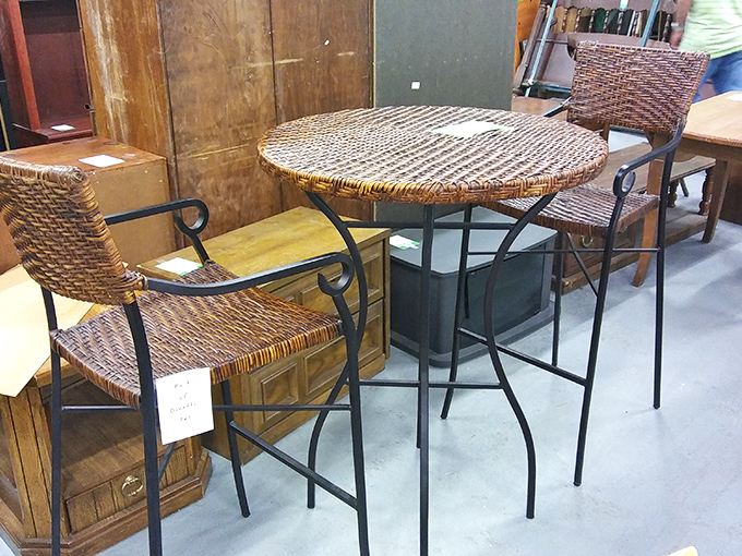 This wicker bistro set screams "morning coffee with the crossword puzzle" or "evening wine while judging the neighbors' landscaping choices."