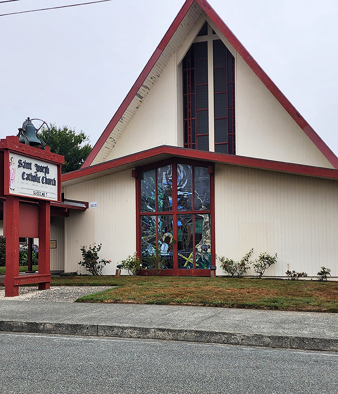 St. Joseph Catholic Church's distinctive A-frame design reaches skyward. The stained glass windows catch morning light, creating a kaleidoscope of colors for Sunday worshippers.