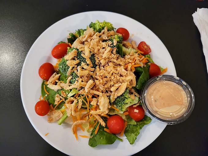A salad that doesn't apologize for being healthy, brightened with cherry tomatoes and topped with enough protein to silence your inner carnivore.