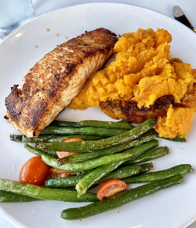 Salmon that's seared to perfection, sweet potato mash with attitude, and green beans that actually make you want to eat your vegetables.