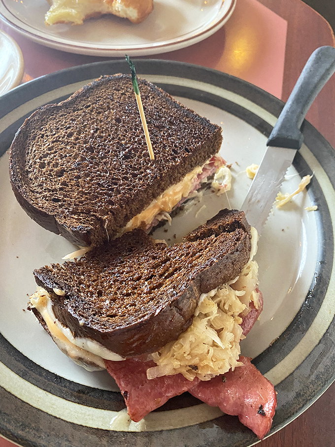 A perfectly grilled sandwich with what appears to be corned beef and sauerkraut&mdash;the kind that makes you wonder why you ever eat anything else.