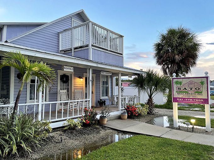 Sato Real Estate's inviting porch practically whispers, "Stay awhile," as puddles reflect the island's laid-back beauty.