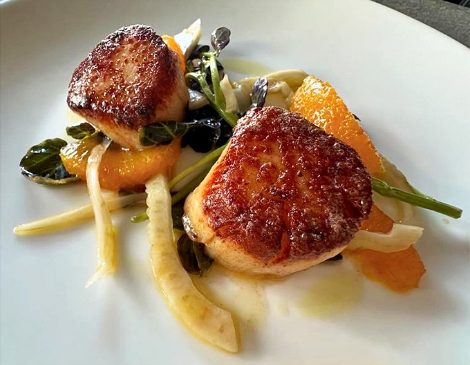 Scallops seared to golden perfection&mdash;like little caramelized pillows of the sea, playing nicely with their citrus friends.