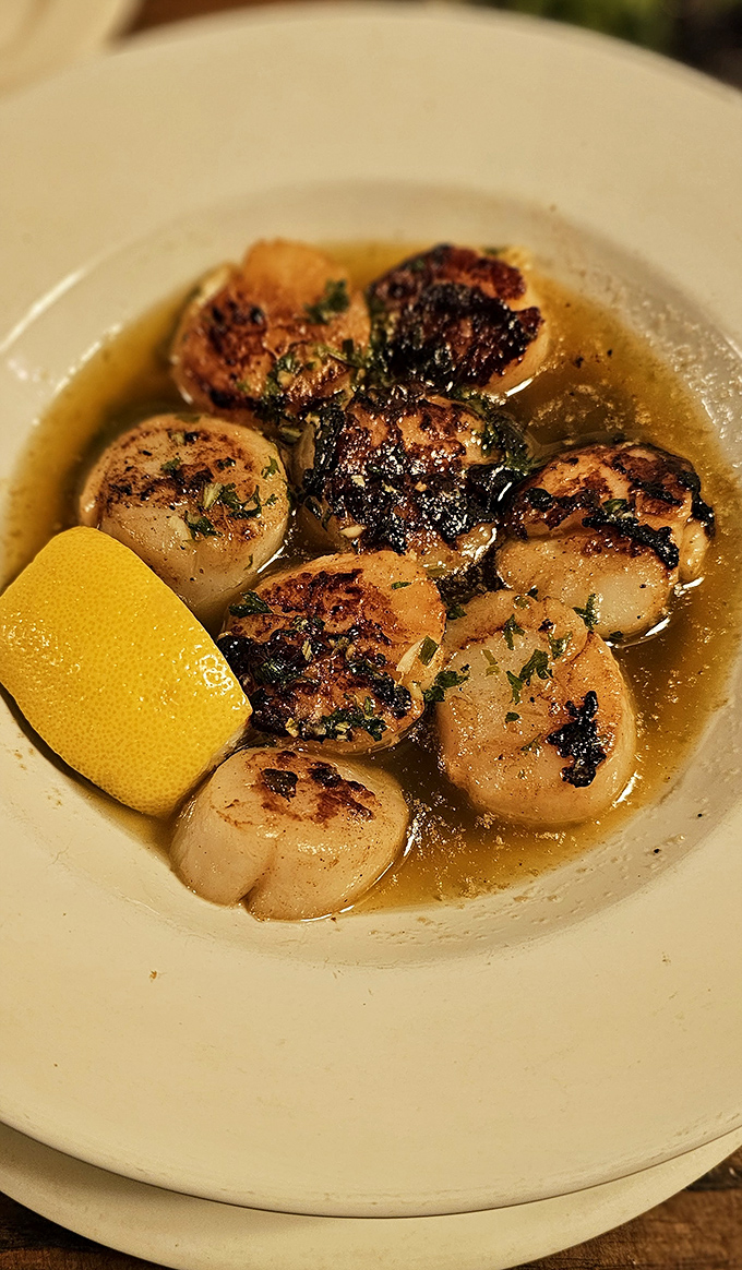 Scallops seared to golden perfection, swimming in buttery bliss&mdash;proof that this steakhouse respects the treasures of the sea equally.