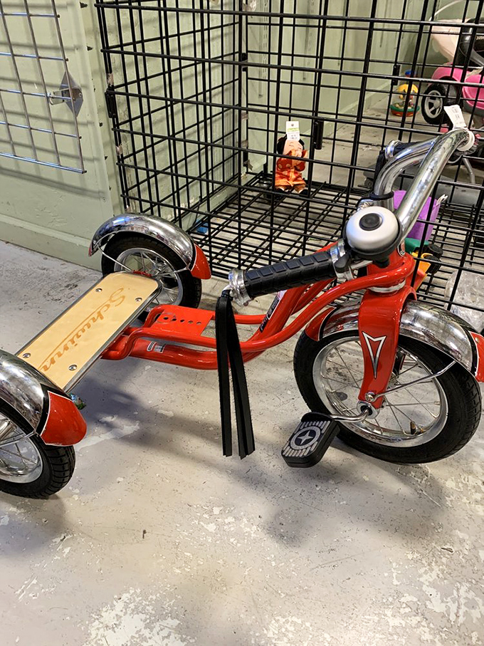 This cherry-red Schwinn tricycle isn't just transportation—it's childhood joy incarnate, waiting for its next adventure.