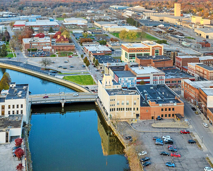 The Shenango River reflects downtown buildings like nature's mirror, adding a peaceful water element to Sharon's urban landscape.