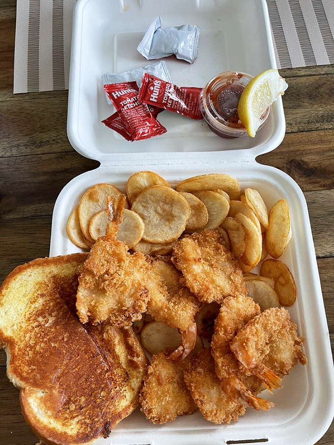 Takeout never looked so tempting. These golden shrimp and chips are ready for their beach picnic debut or a cozy car feast.