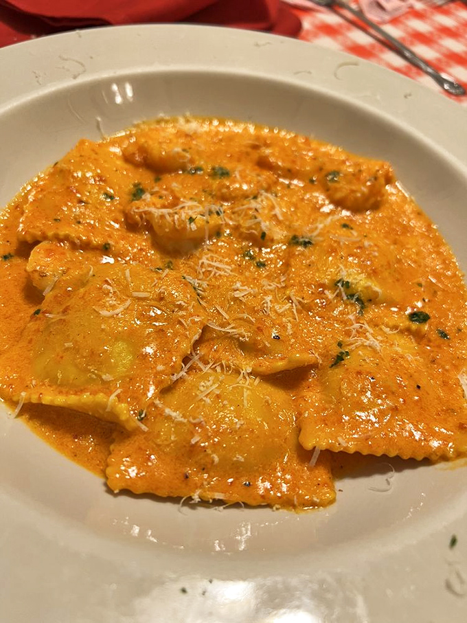 Ravioli bathing in a sunset-colored sauce. Those pasta pillows are stuffed with treasures that would make Neptune himself order seconds.