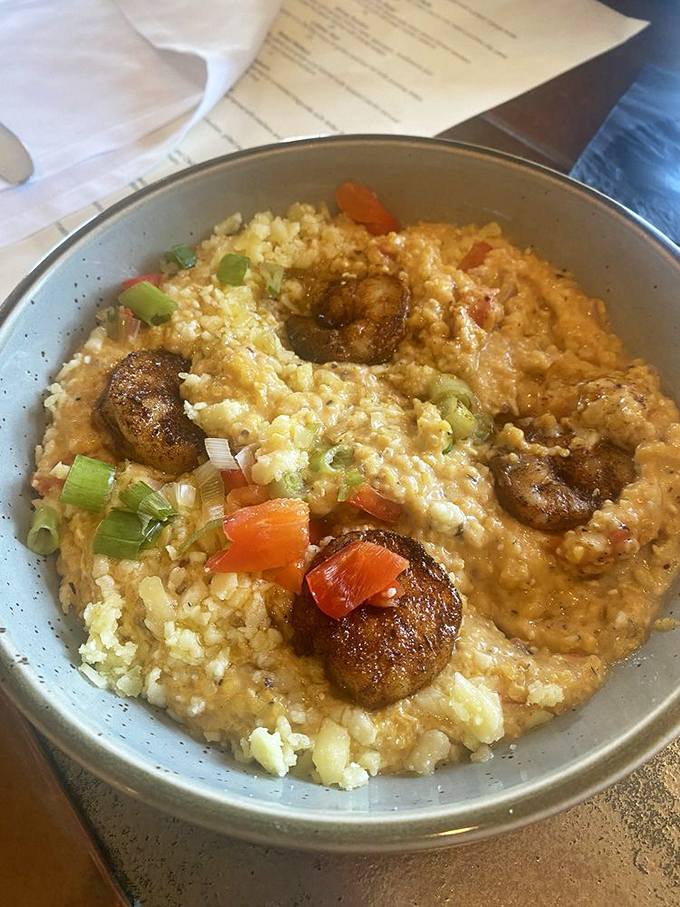 Southern comfort reimagined &ndash; these shrimp and grits tell a story of tradition with a gourmet plot twist. Those blackened shrimp deserve their own fan club.