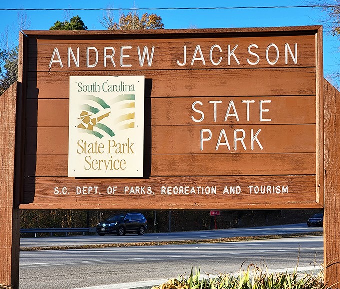 The park's wooden entrance sign stands as a rustic gatekeeper to history and nature &ndash; less "theme park spectacular" and more "genuine South Carolina charm."