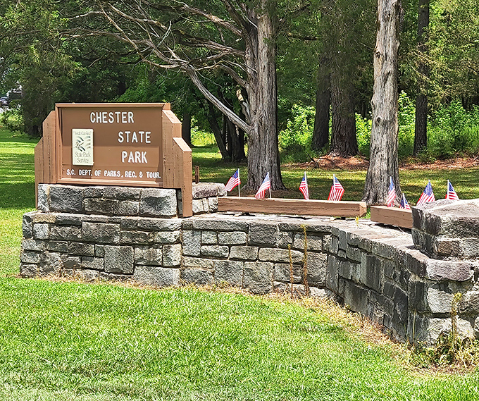 The park's entrance sign, built with classic CCC stonework, stands as a timeless gateway to adventures that don't require Wi-Fi or charging stations.