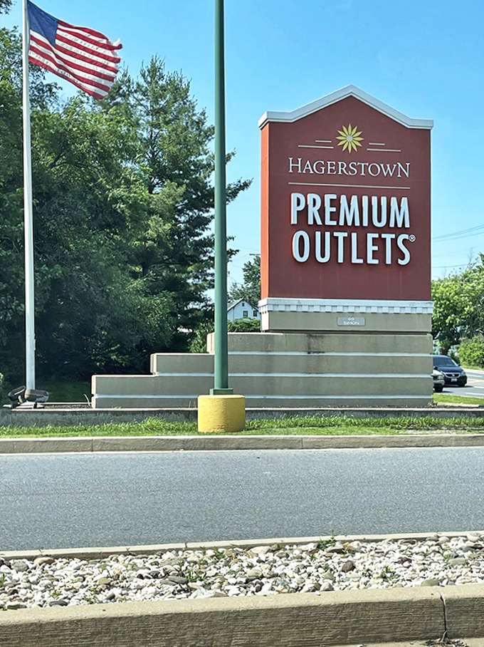 Standing proud against Maryland's blue sky, this sign has directed countless bargain hunters to their happy place.