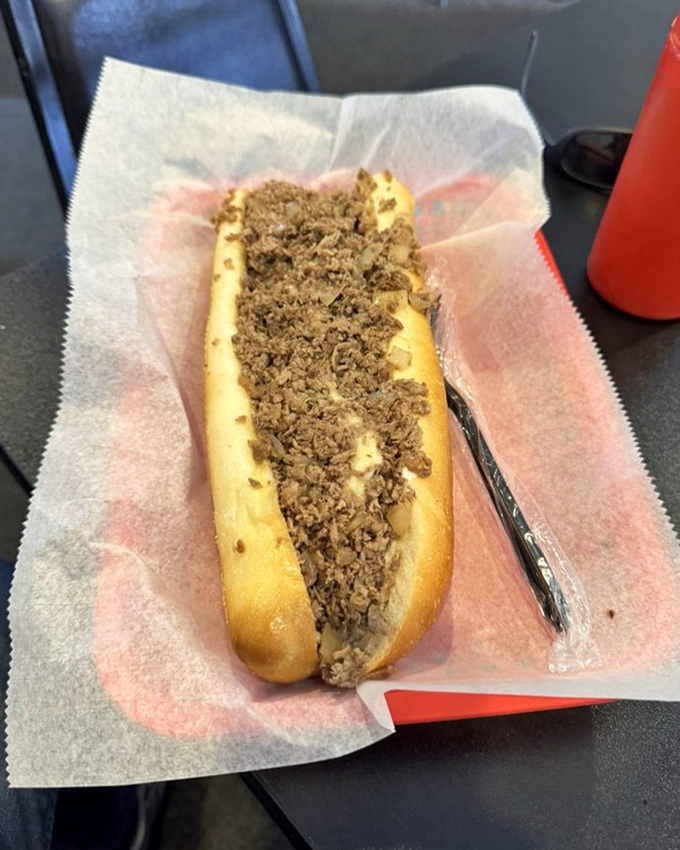 A cheesesteak that understands portion control is for another day. This handheld masterpiece demands your full attention and both hands.