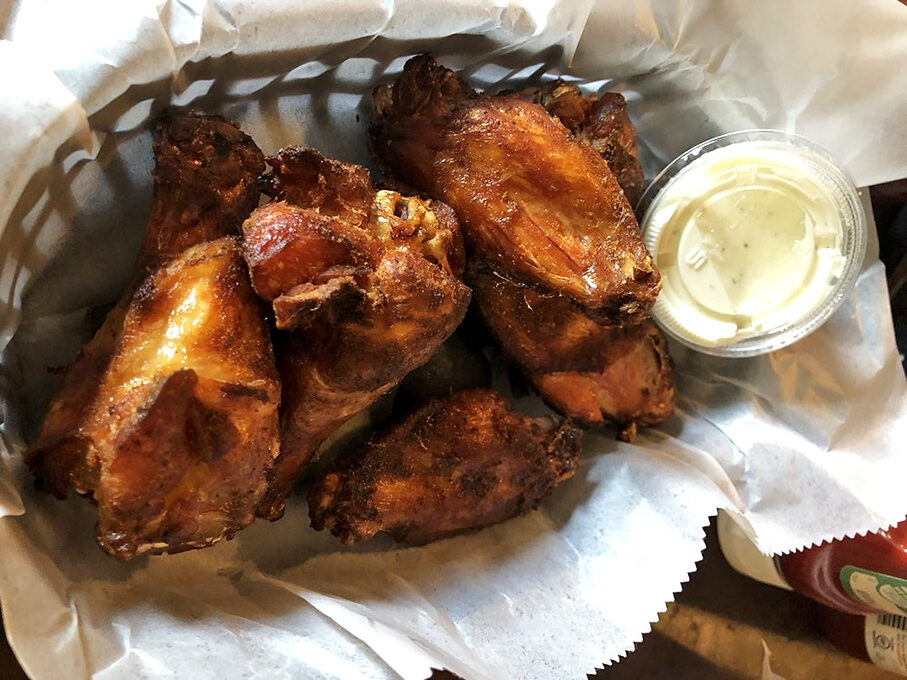 Wings with a smoke-kissed mahogany finish that would make fine furniture jealous. The dipping sauce is merely a formality.