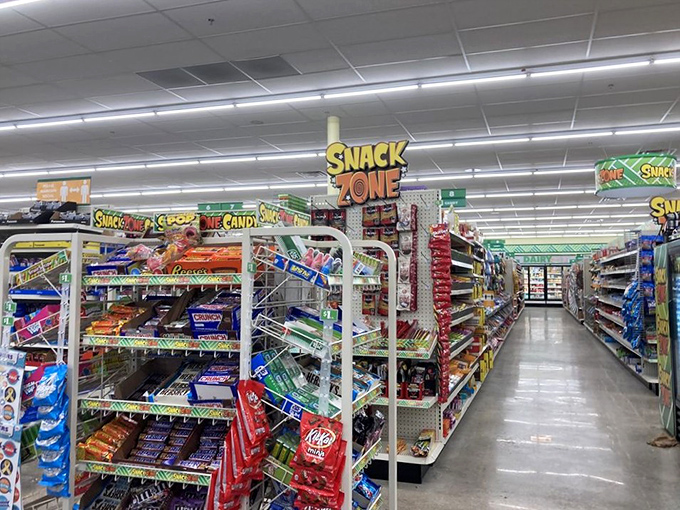The "Snack Zone" sign hovers like a neon North Star, guiding hungry shoppers toward name-brand treats at prices that feel like a clerical error.