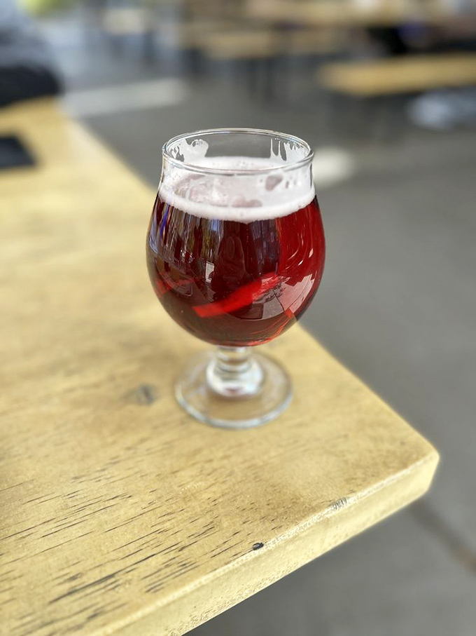 A ruby-hued beer catching the light like liquid amber &ndash; the perfect counterpoint to barbecue's rich embrace.