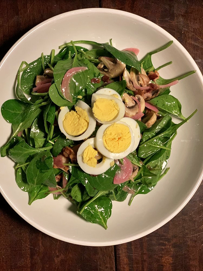 Even salads get the star treatment &ndash; fresh spinach, perfectly boiled eggs, and what appears to be house-smoked bacon create a bowl that even carnivores will respect.