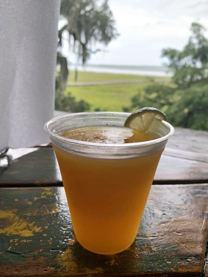 A cold beer with a lime wedge against the backdrop of marshland&mdash;sometimes paradise is this simple.