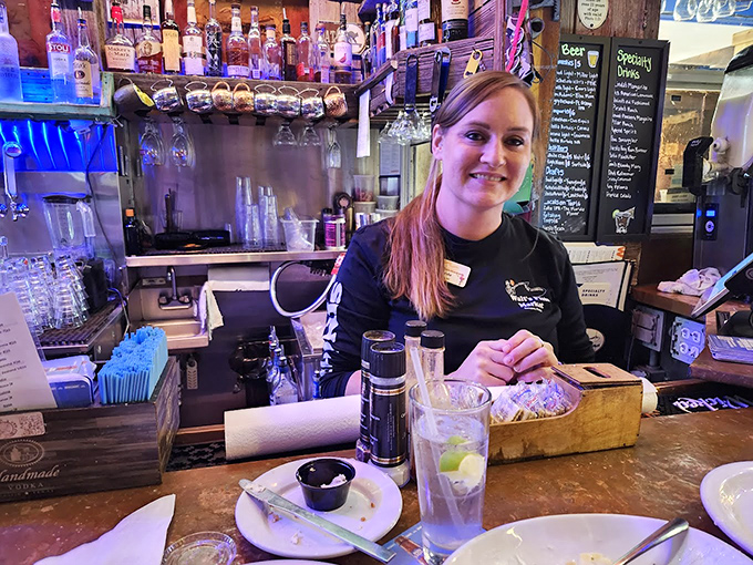 Behind every great seafood joint is a bartender who knows the difference between serving drinks and serving happiness with a splash of local wisdom.