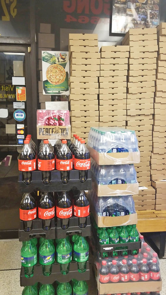 Behind every great pizza joint is a wall of empty boxes waiting to be filled with circular happiness.