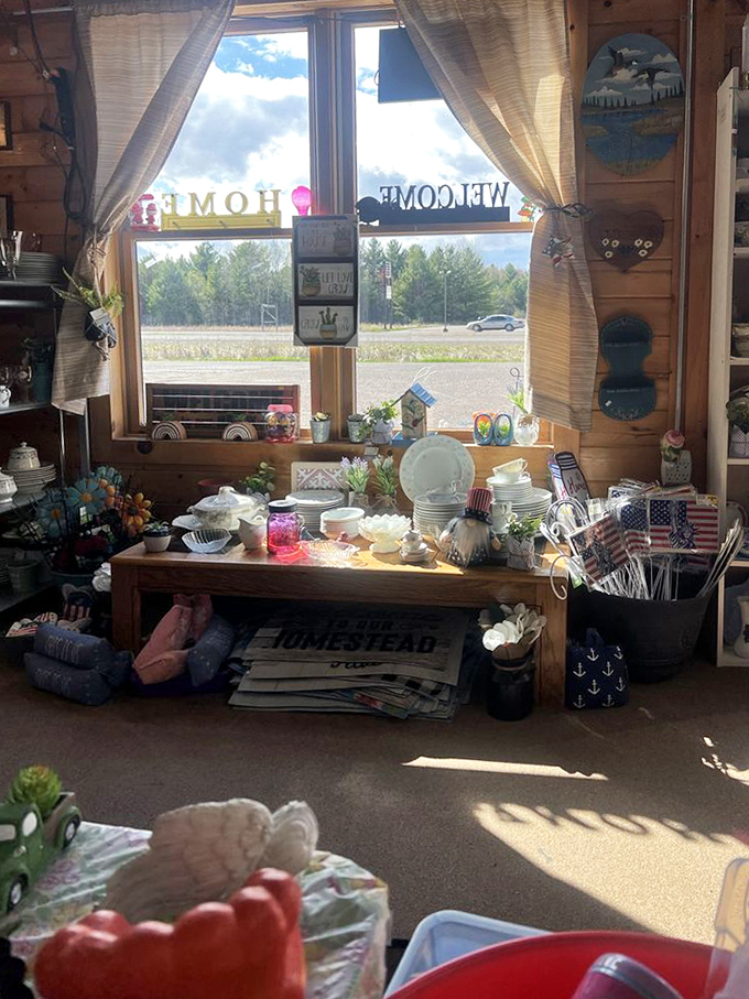 Sunlight streams through curtained windows, illuminating a display that's part country charm, part nautical whimsy, and entirely irresistible.