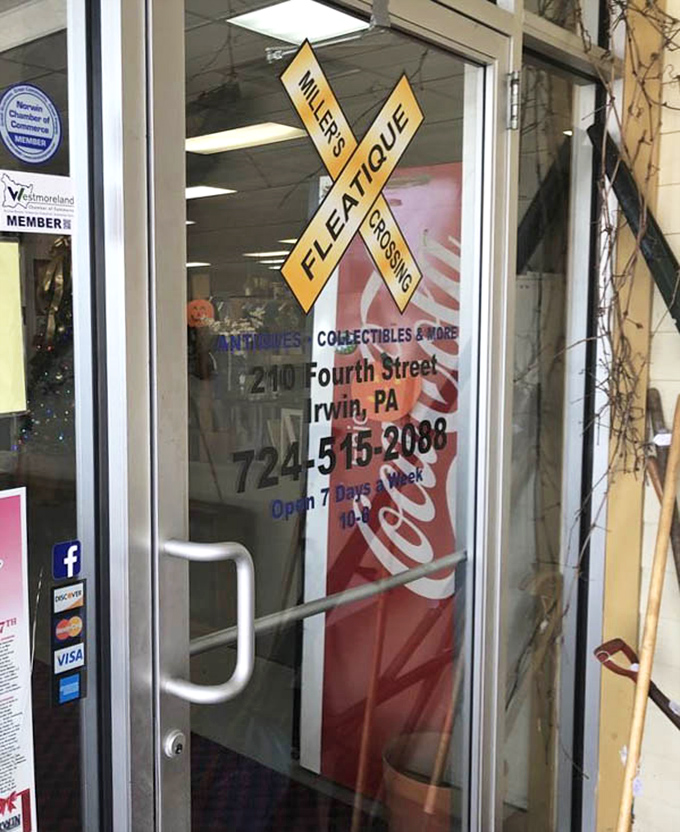 The iconic railroad crossing sign welcomes bargain hunters to their happy place. Seven days a week of treasure hunting? That's commitment to the cause.