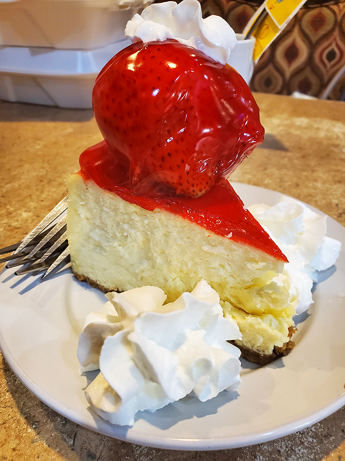 Strawberry cheesecake that doesn't just end a meal—it throws a victory parade for your taste buds with whipped cream confetti.