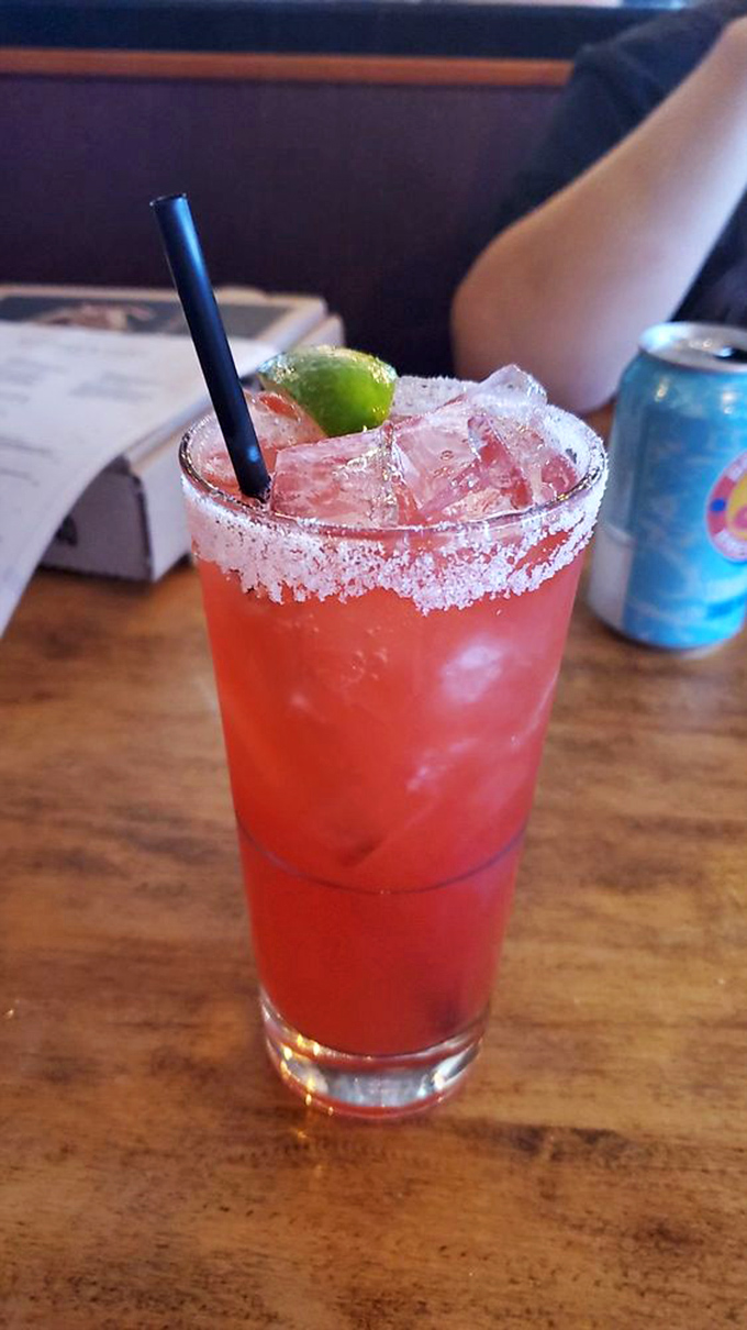 A strawberry margarita with a salt rim so perfect it deserves its own Instagram account. Refreshment that complements rather than competes with pizza.