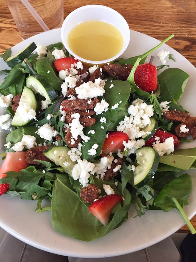 A salad that people actually crave&mdash;fresh greens, strawberries, feta, and candied nuts that make eating vegetables feel like breaking the rules.