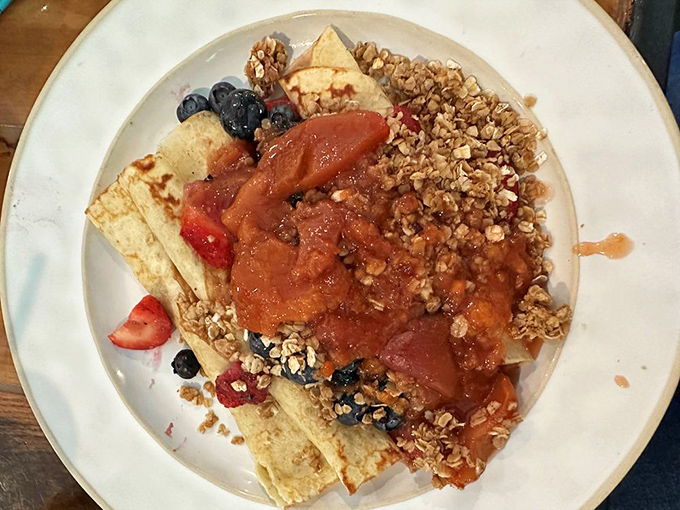 Crepes adorned with fresh berries, granola, and fruit compote&mdash;the breakfast equivalent of wearing a ball gown to the grocery store. Gloriously excessive. 