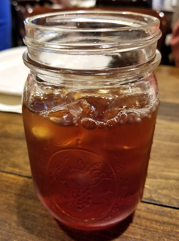 Sweet tea in a mason jar—the unofficial champagne flute of the South. One sip and you'll be saying "y'all" unironically.
