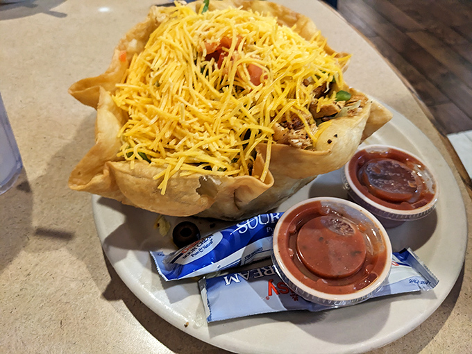 A taco salad that doesn't know it's supposed to be health food, and we wouldn't have it any other way. That cheese blanket is pure Midwestern genius.
