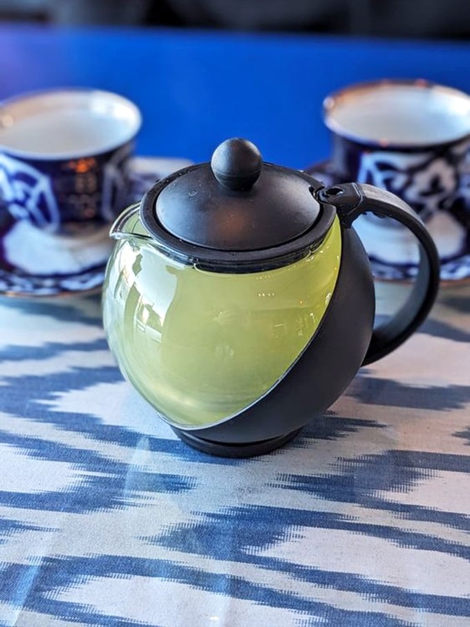 The tea service isn't just a beverage&mdash;it's a ritual, served in traditional patterned cups that warm both hands and spirit.