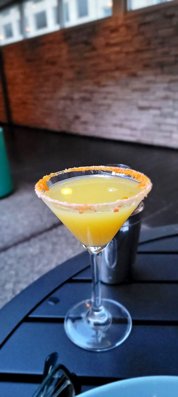 This sunshine-yellow martini with its sugared rim isn't just a cocktail—it's liquid optimism in stemware.