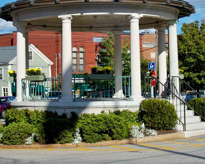 Exeter's bandstand up close reveals meticulous maintenance and seasonal plantings, a community treasure that's both functional landmark and visual centerpiece.