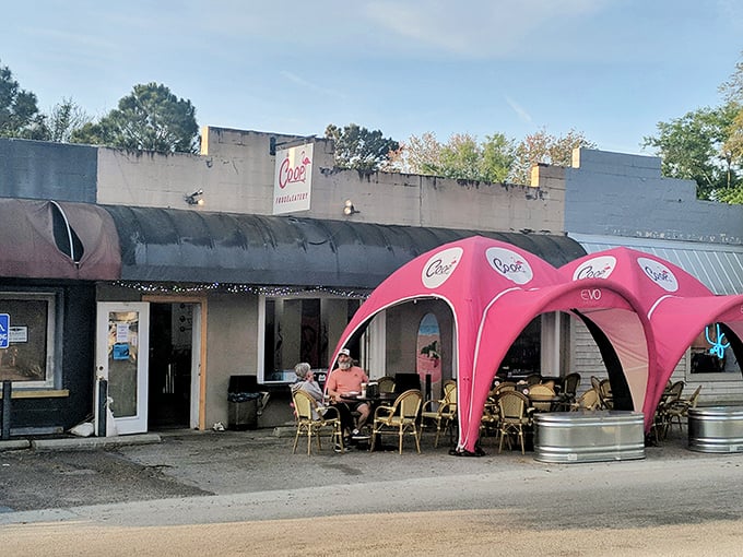 Poe's Tavern isn't just serving burgers &ndash; it's serving atmosphere. Those pink canopies aren't just for shade; they're setting the stage for island memories.