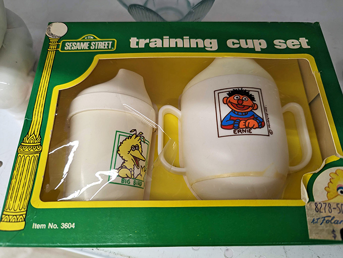 Vintage Sesame Street training cups&mdash;Big Bird and Ernie ready to help with toddler transitions. Nostalgic parenting at bargain basement prices!