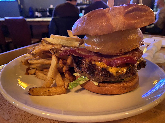 This burger means business with its perfectly stacked layers creating a symphony of flavors in every bite.