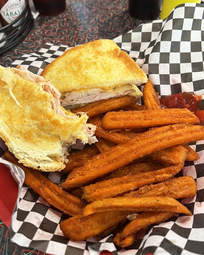 This sandwich isn't playing games&mdash;turkey, melted cheese, and those sweet potato fries on the side are staging a delicious rebellion against boring lunches.