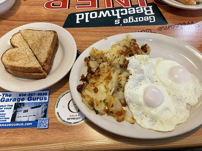 Two eggs cooked exactly how you like them, golden-brown home fries, and toast that's actually buttered all the way to the edges.