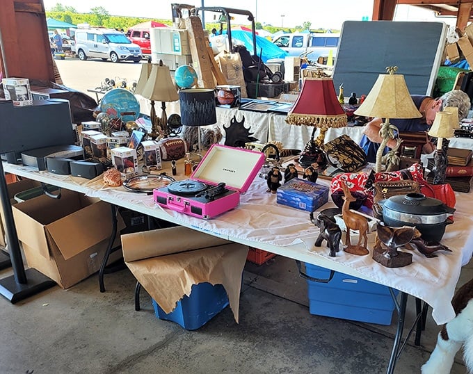 One person's random assortment is another's perfectly curated collection. This table of lamps, electronics and figurines is a microcosm of flea market magic. 