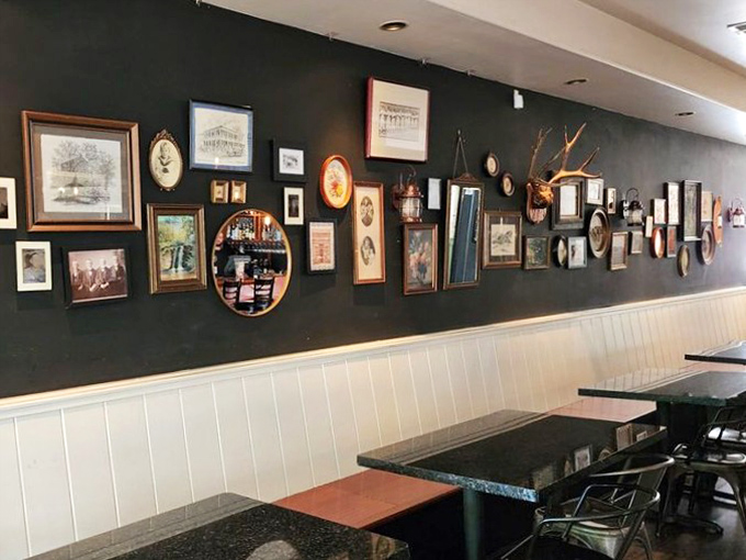 The gallery wall isn't just decoration&mdash;it's a visual history lesson that gives you something to admire while waiting for your meat sweats to subside.