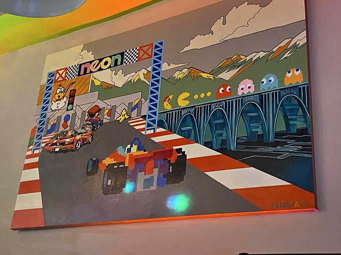 This mural captures gaming's essence perfectly&mdash;Pac-Man ghosts and racing checkered flags coexisting in pixel-perfect harmony.